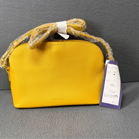 passedix | Bags | Yellow Textured Crossbody Bag With Curved Design ...
